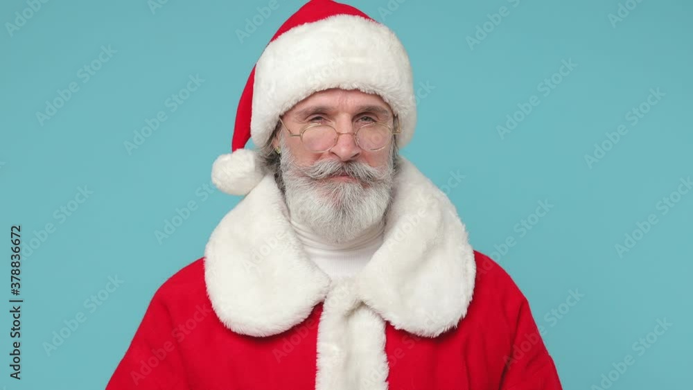 Vidéo Stock Santa Claus man in Christmas hat red suit coat white gloves ...