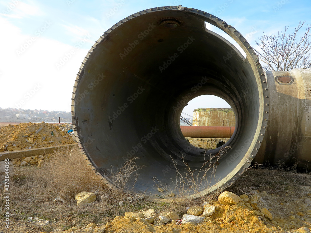 Old rye pipes of large diameter lie on the ground. Pipeline. Large iron ...