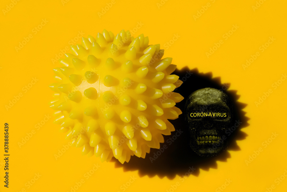 Abstract image of coronavirus. A yellow spiked ball and its shadow with ...
