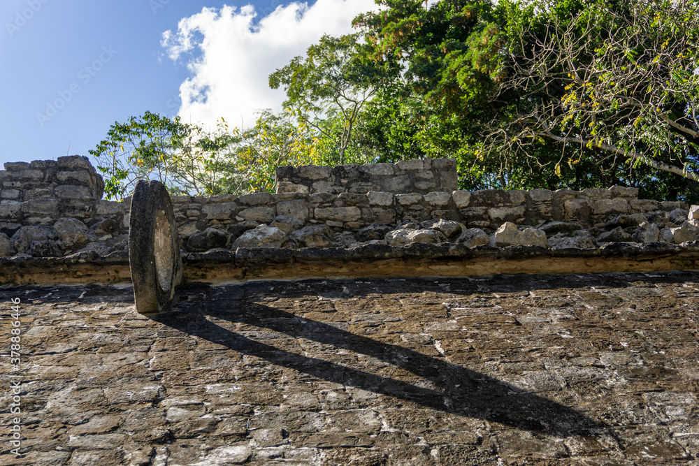 A stone rings casts a long shadow in the late afternoon on an ancient ...