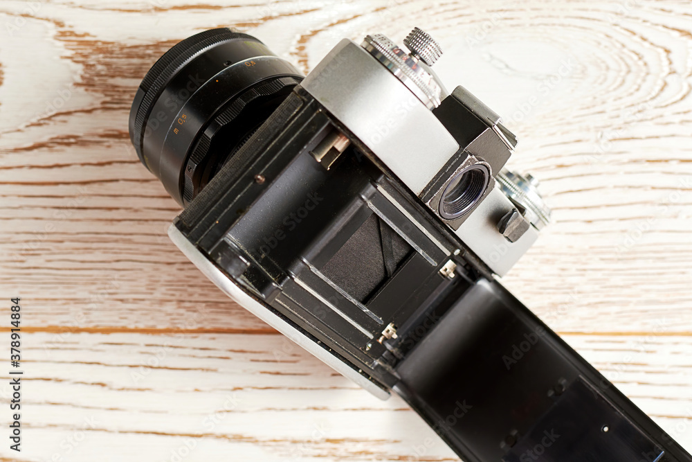 Vintage film camera opened from the backward. Retro objects and ...