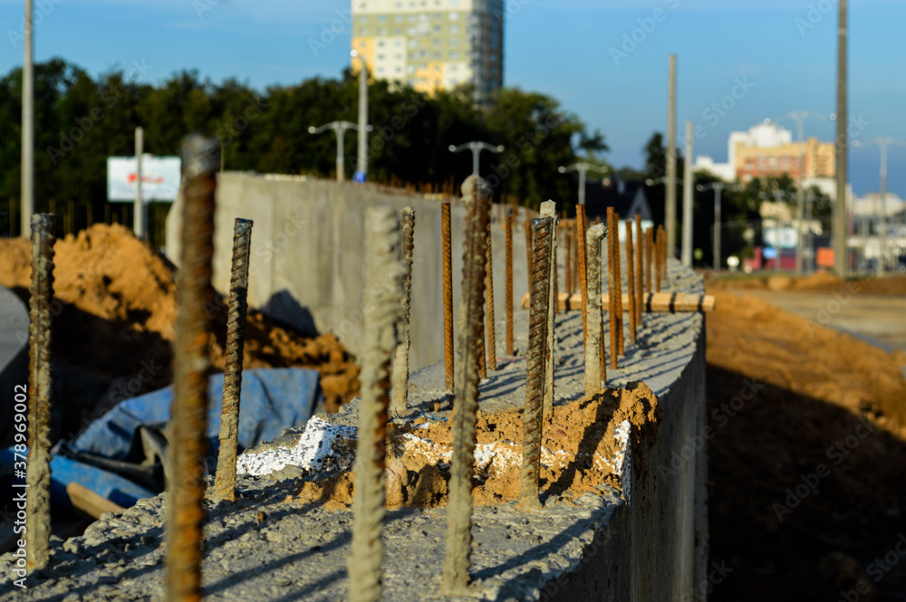 rusty pins sticking out of concrete blocks. laying of blocks for the ...