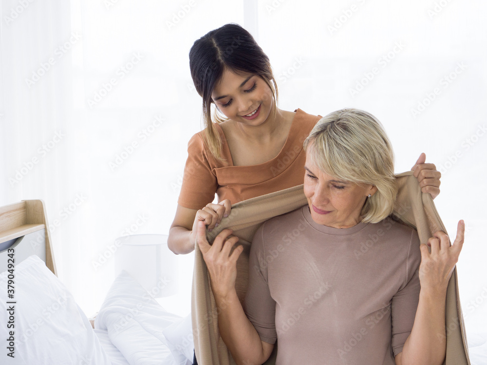 Happy mix skin family living together, asian daughter wears a cloak for ...