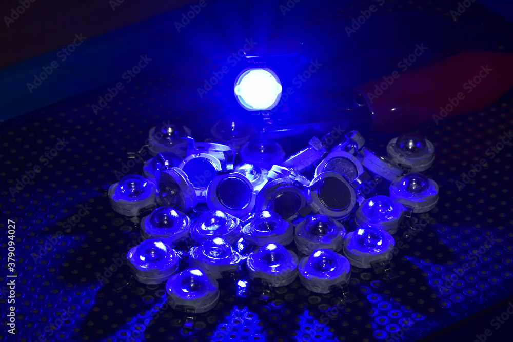 Blue semiconductor LEDs in a ceramic package with a metal heat sink ...