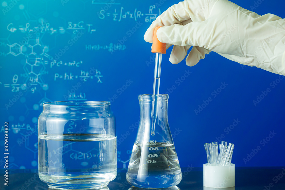 Hands of clinician holding tools during scientific experiment ...