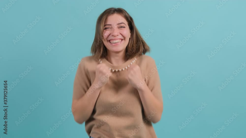 Yes, I done it. Excited cheerful female model with joyful expression ...