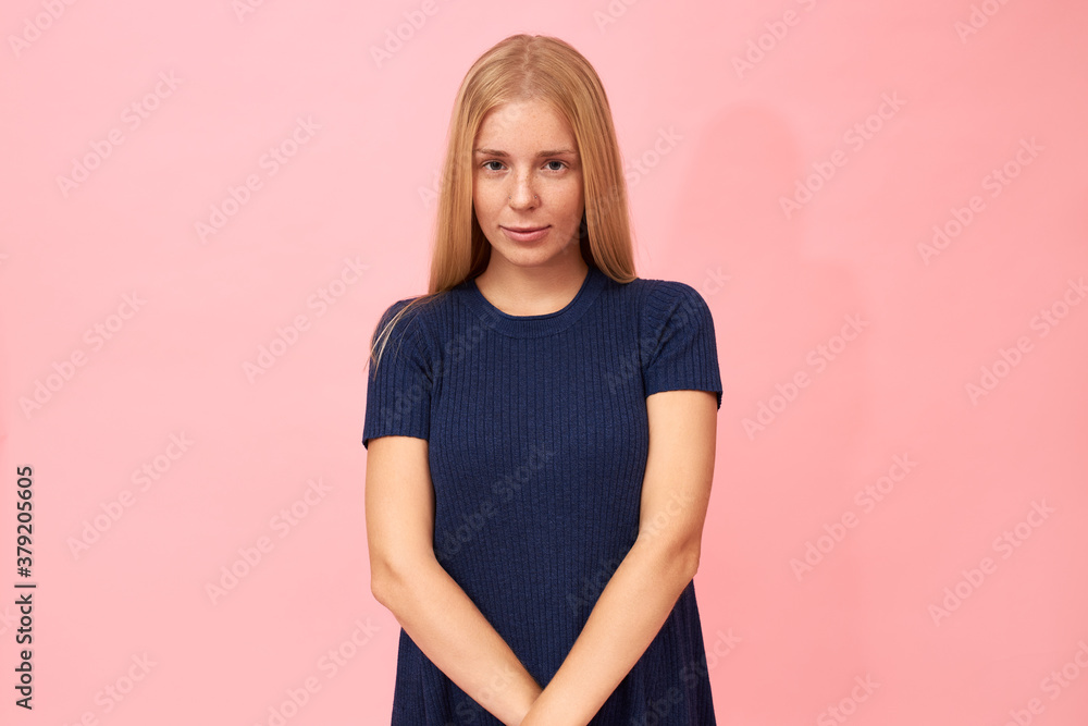 Shyness, timidity and self consciousness. Studio shot of beautiful ...