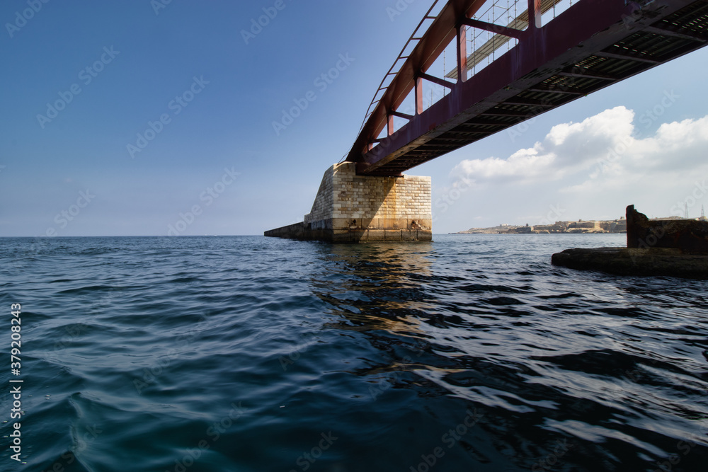 Old huge abandoned rusty bridge above water. Coast. Summer. bridge ...