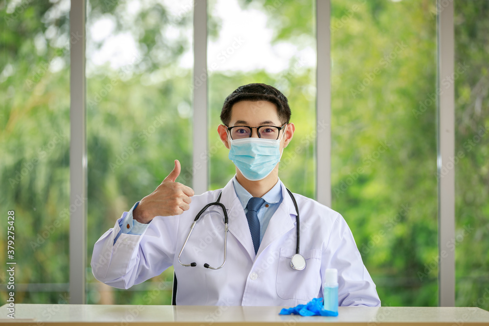 doctor demonstrates how to wear a mask correctly Stock Photo | Adobe Stock