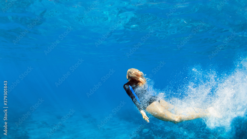 Happy family - active teenage girl jump and dive underwater in tropical ...