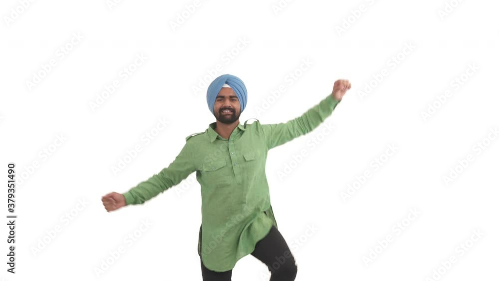 Young beard Indian man performing traditional dance movement in ...