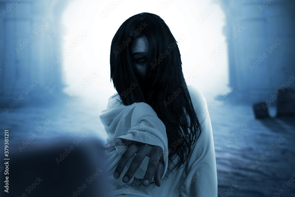 Scary ghost woman crawling with a graveyard background Stock Photo ...