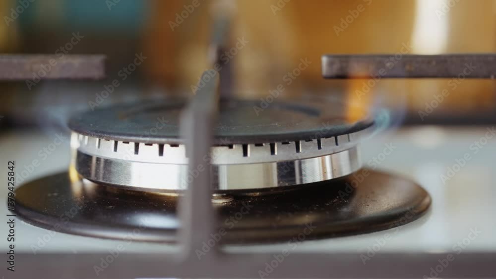 Close-up. The fire burns on a working burner. The fire covers the parts ...