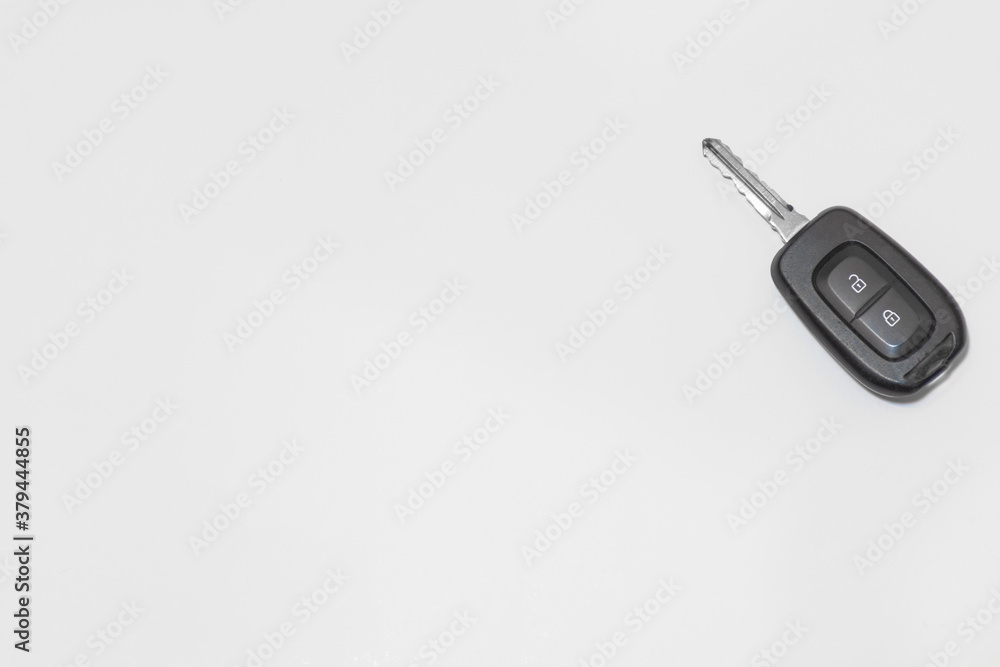 closeup of an isolated car and house keys kept on a marble floor with ...