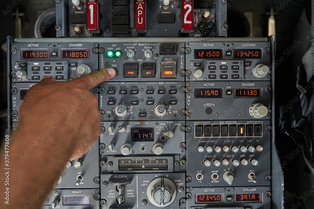 Pushing the button on control panel while piloting the plane Stock ...
