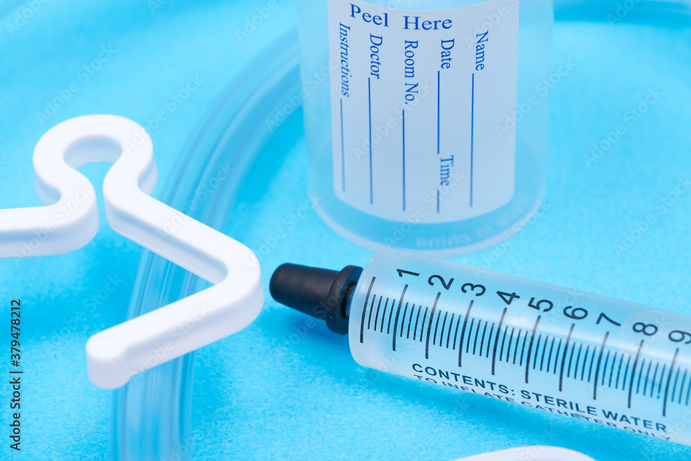 Sterile urinary drainage bag, 10 ml syringe pre-filled with sterile ...