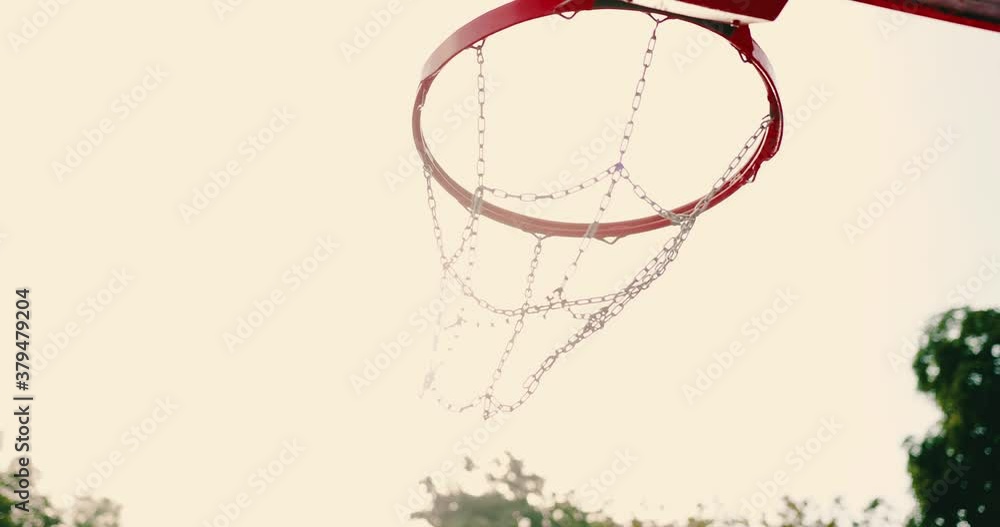Vidéo Stock Close up shot of ball hitting basketball hoop outdoor on ...