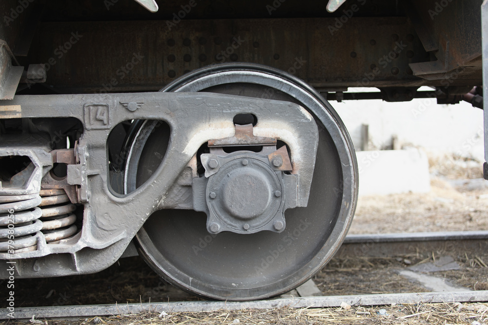 wheel mechanism of modern train locomotive on tracks. Steampunk, techno ...