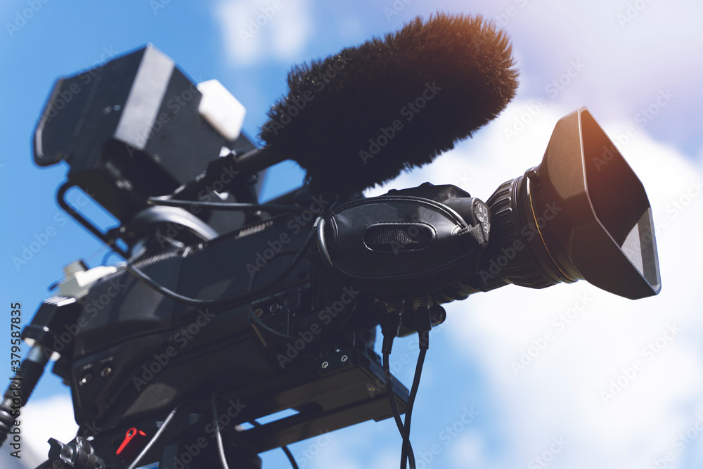 Video camera - Ready for recording show in outdoor TV studio - focus on ...
