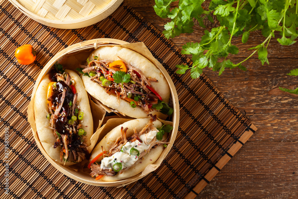 Pulled pork in a Bao Bao roll. Top view. Stock Photo | Adobe Stock