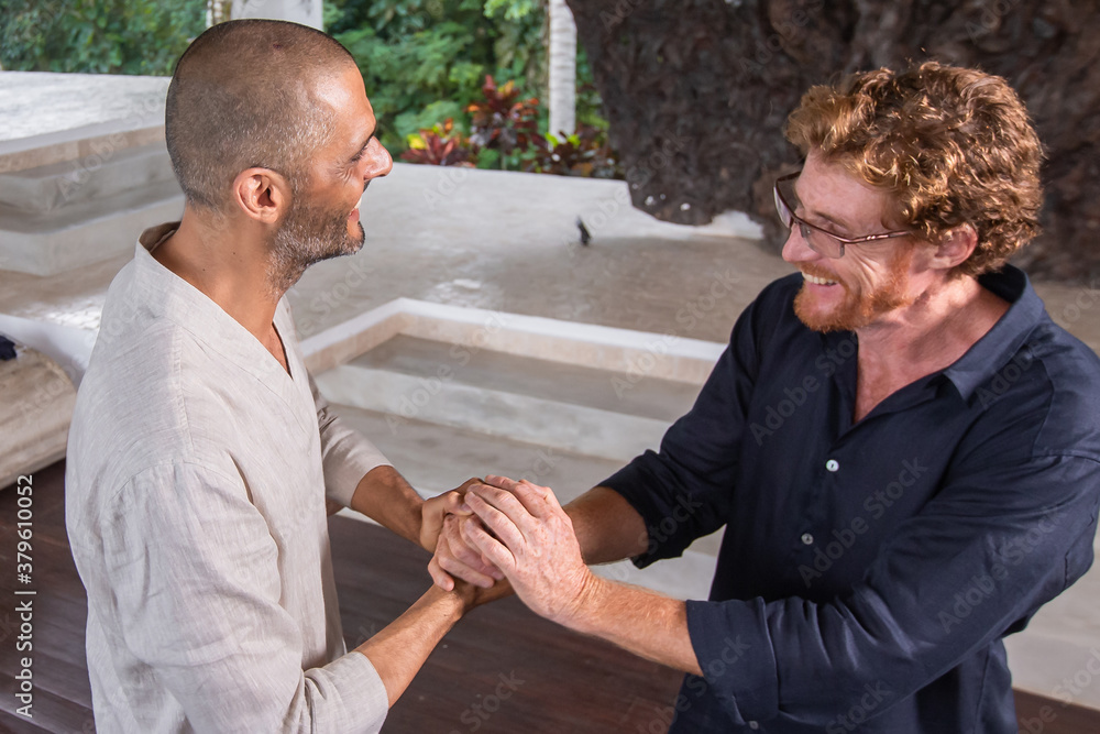 Diverse group of multiethnic people embracing and giving hugs to each ...