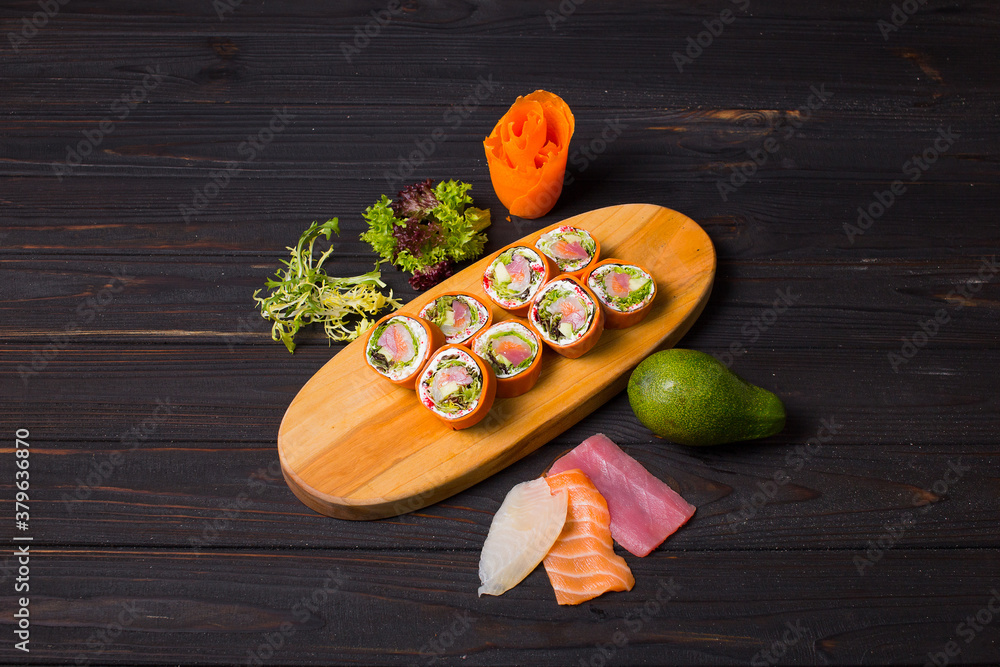 Side view of Japanese sushi roll without rice with raw salmon, tuna and ...