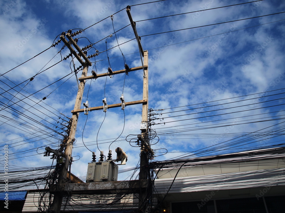 Three-phase transformer on pole. Complete with a set of fuses and an ...