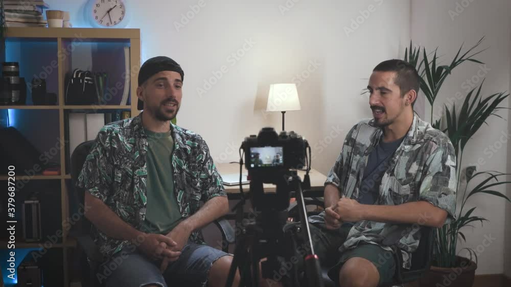 2 young man vlogger record interview video on camera for social media ...