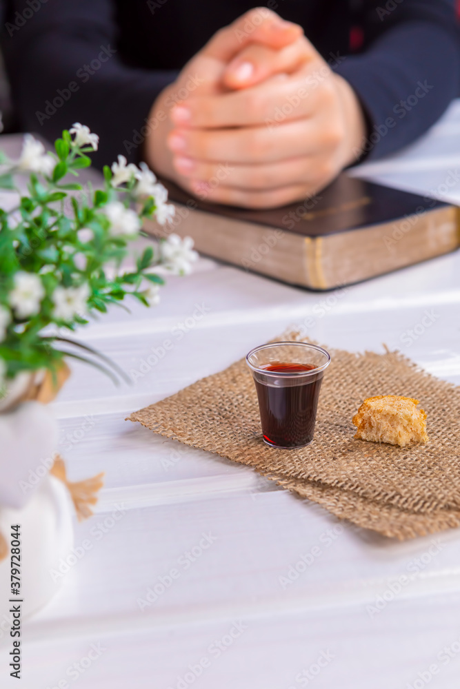 Foto de Young woman praying and Taking communion - the wine and the ...
