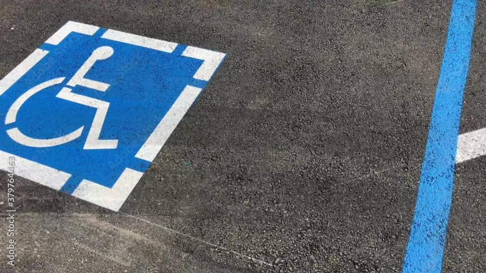 ADA handicapped sign with handicapped wheelchair symbol marks ...