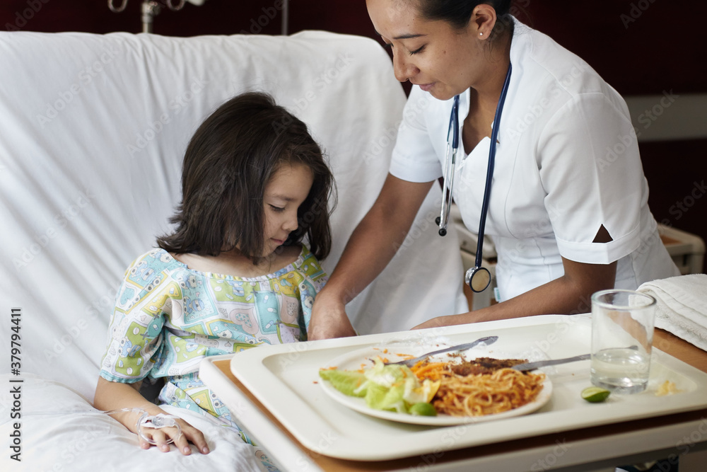 Nurse being friendly to cute little girl at hospital Stock Photo ...
