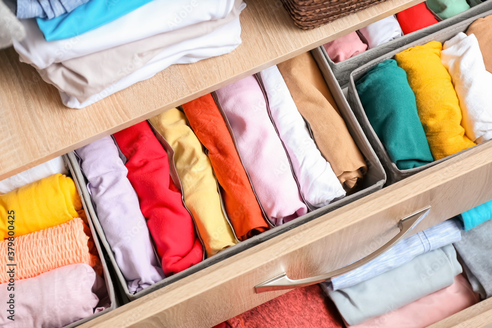 Open drawer with clean clothes in closet Stock Photo | Adobe Stock