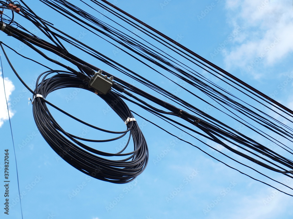 Electric wires roll on the cable. There is a low voltage line above it ...