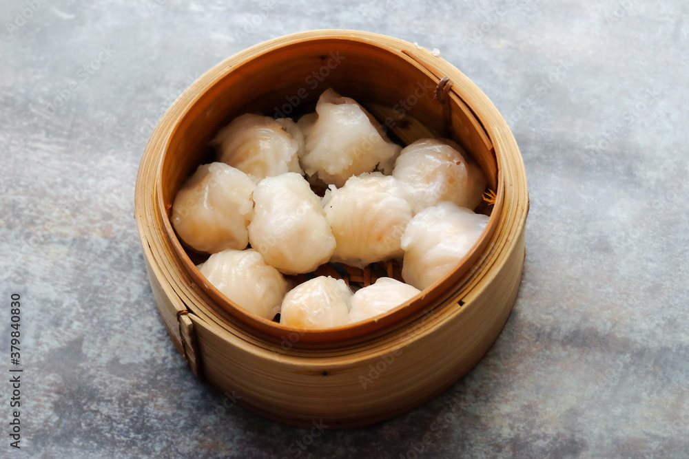 Asian steamed dish. Dim sum on a food shelves, various Chinese steamed ...