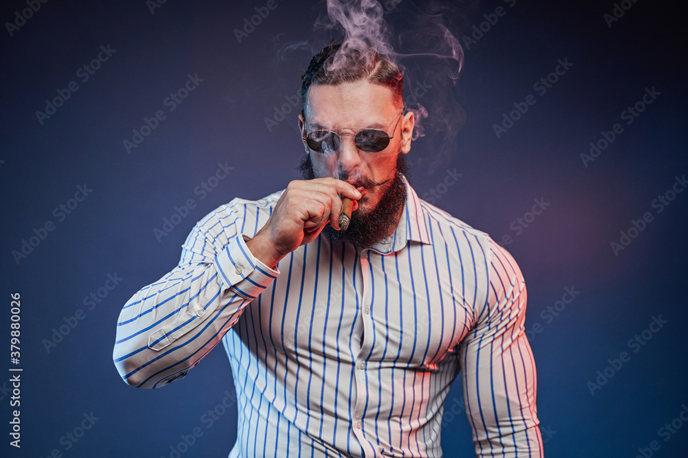 Elegance and bearded bodybuilder in fashion of mafia member smoking ...