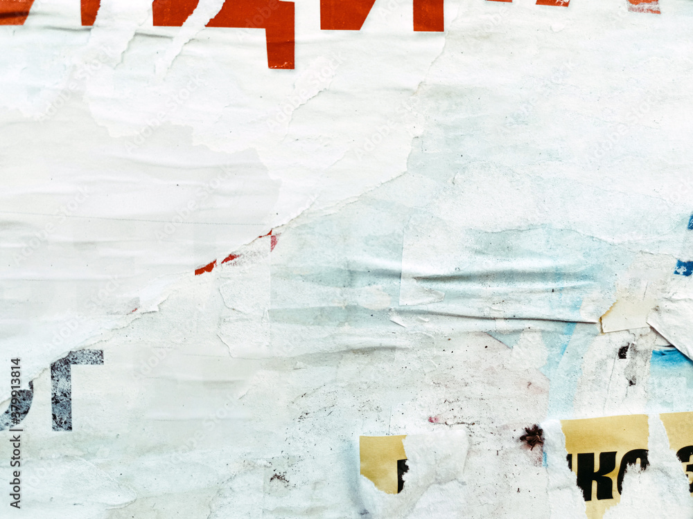 Layers of vintage posters glued and torn with time to the wall Stock ...