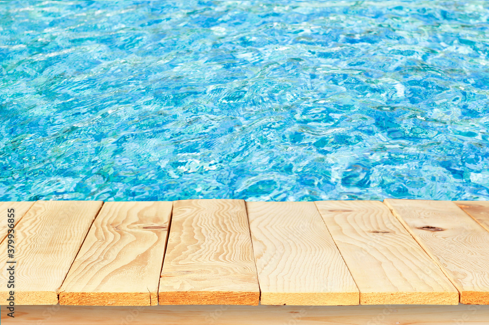 Wood table top on Surface water in pool background - can be used for ...