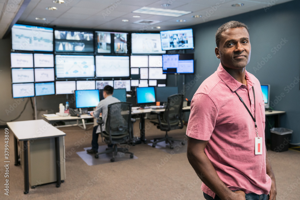 Portrait of a black technician in a server room monitoring cente Stock ...