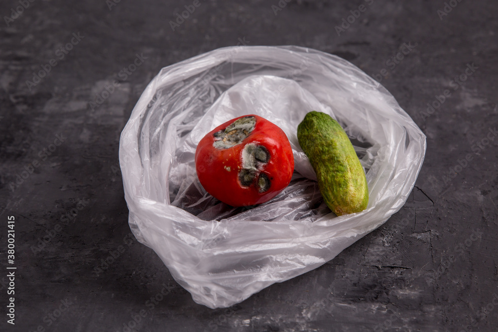 Foto de Food waste. spoiled tomato, rotten cucumber. Black mold on food ...