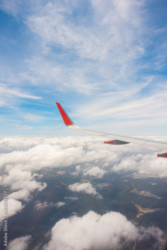 generic scene from plane window, with clouds Stock Photo | Adobe Stock