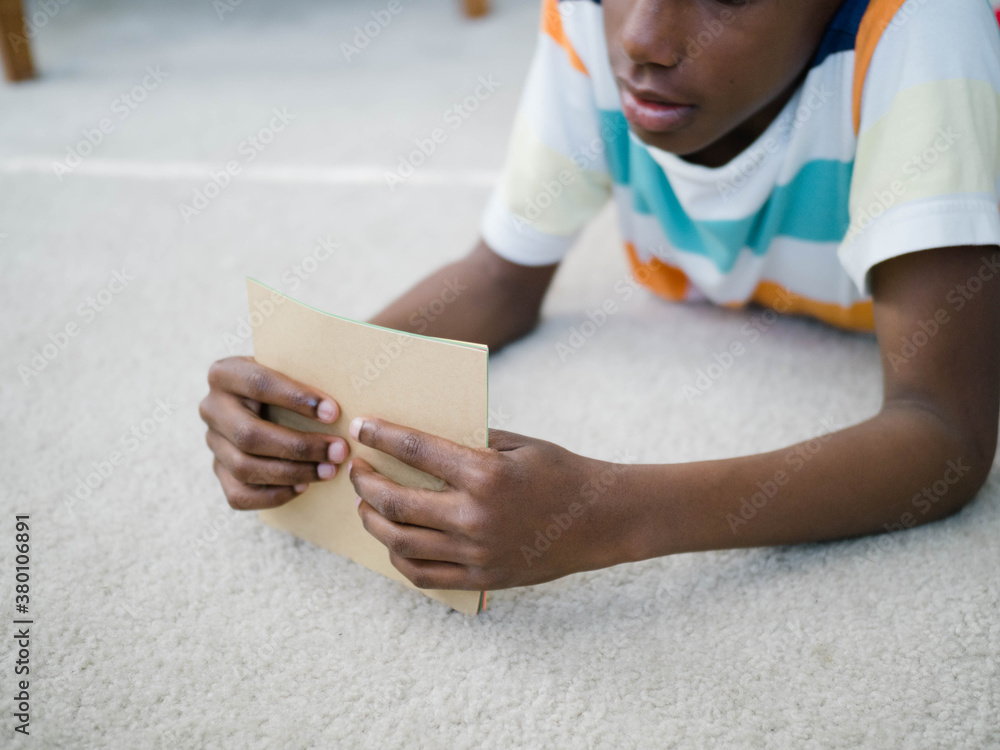 Young boy gathering Origami paper Stock Photo | Adobe Stock