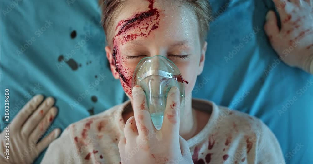 Top view of paramedics hands taking off oxygen inhalation mask from ...