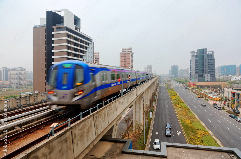 Scenic view of a metro train traveling on elevated rails of Taoyuan Mass Rapid Transit System ...