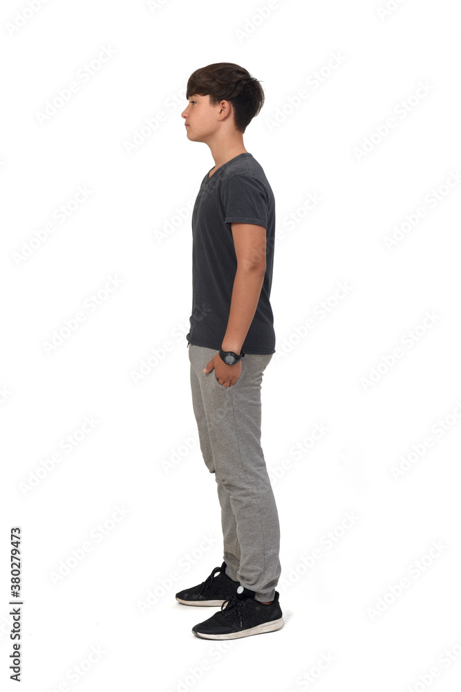 full portrait of a teenage boy dressed in sportswear on white ...