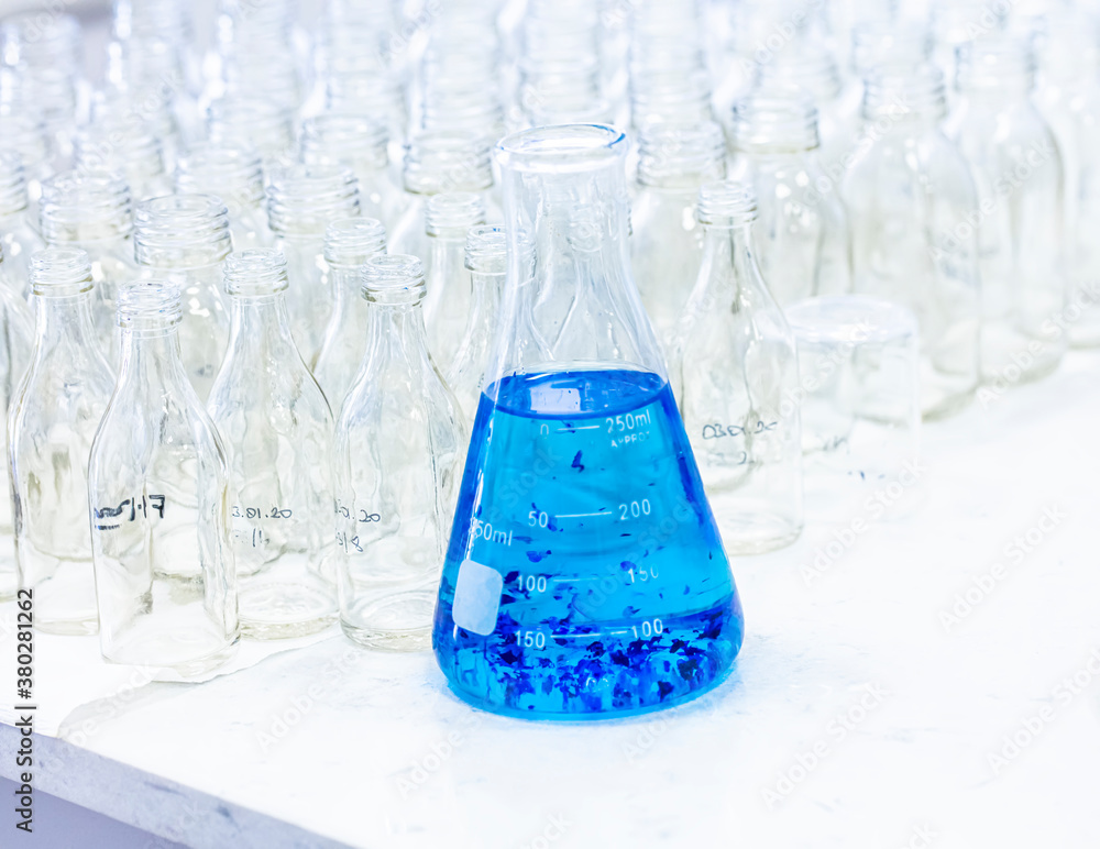 blue solution (methylene blue) in erlenmeyer, experiments in chemistry ...