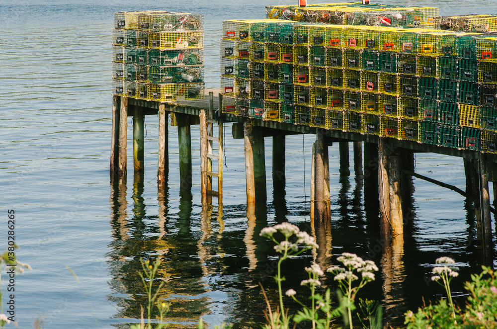 dock with stacks of lobster traps Stock Photo | Adobe Stock