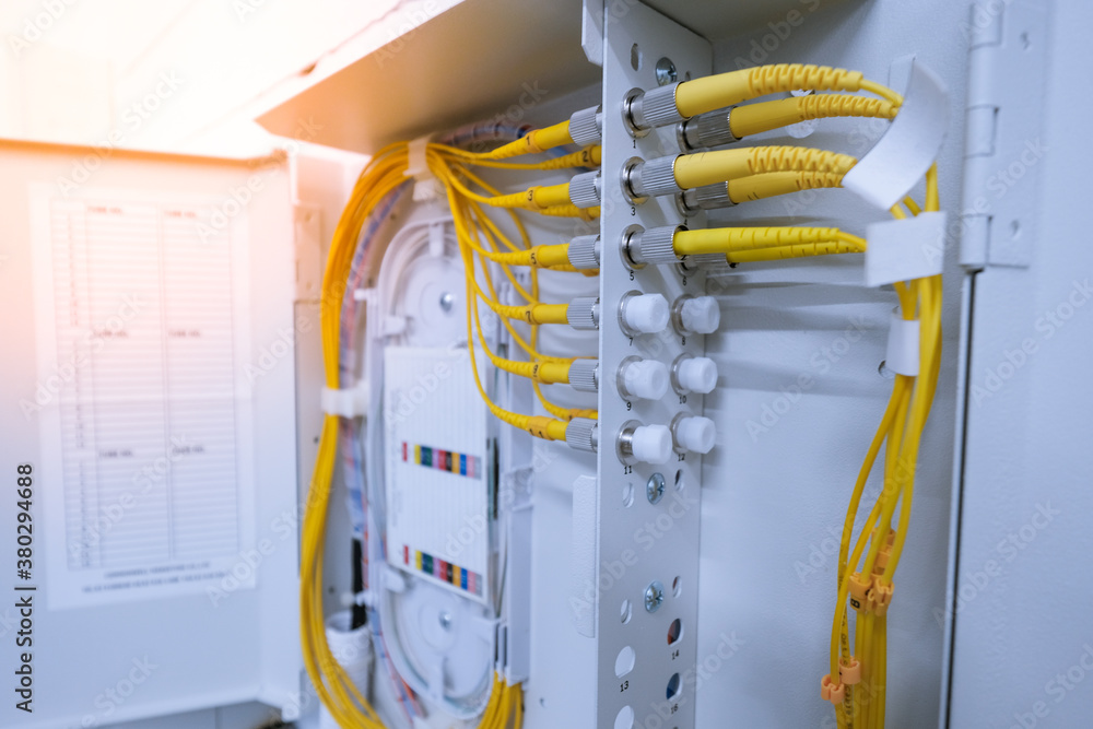 fiber optic cable connected to enclosure box in a technology data ...