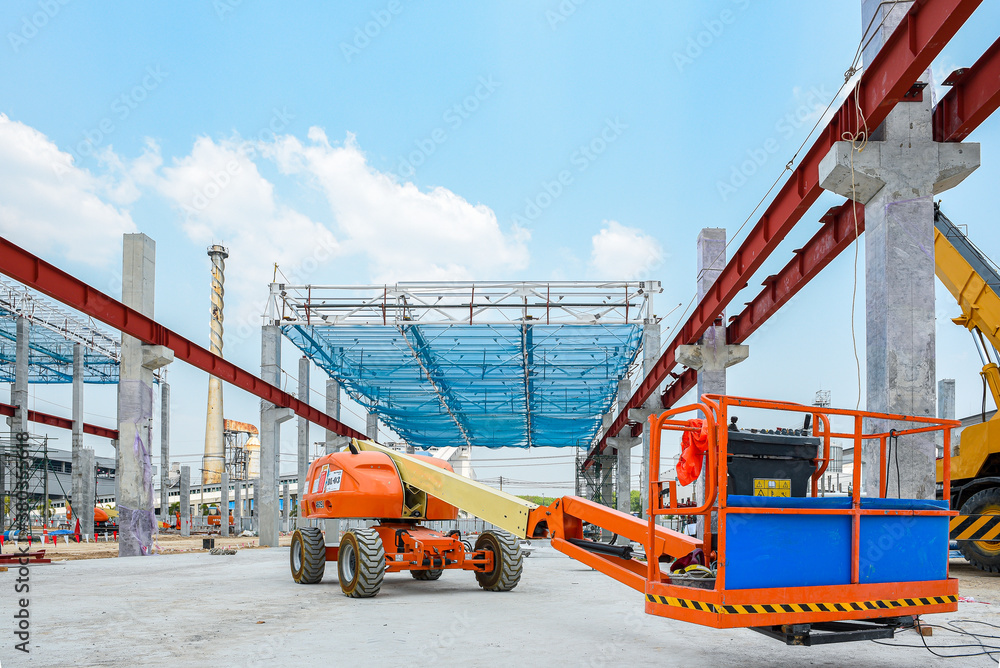 Boom lift standby with Steel structure roof truss installed under at ...