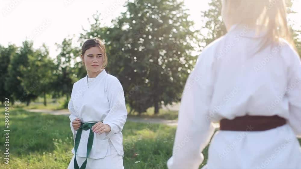 Two young female athletes practice their attack and defense skills in ...