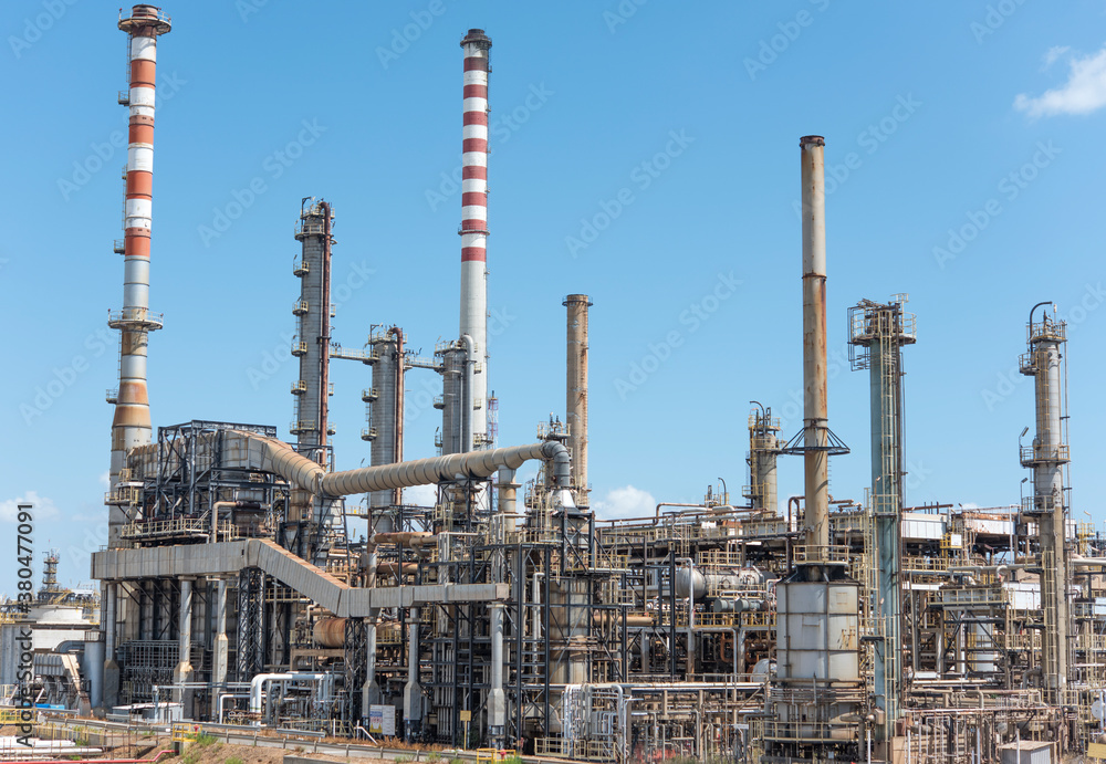 Oil and gas refinery, pipelines and towers, heavy industry Stock Photo ...
